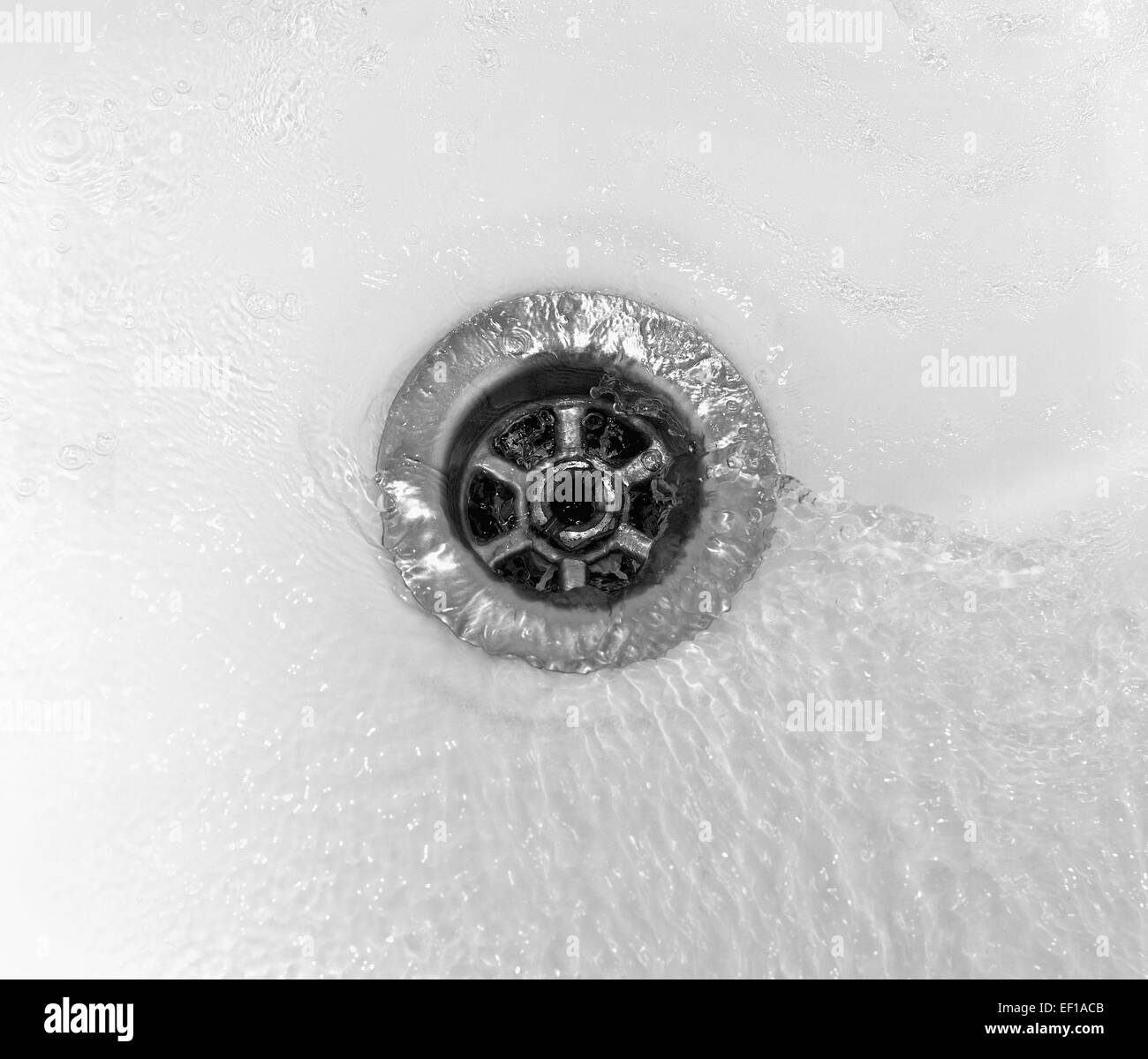 Water flows into the drain enamel sink Stock Photo - Alamy