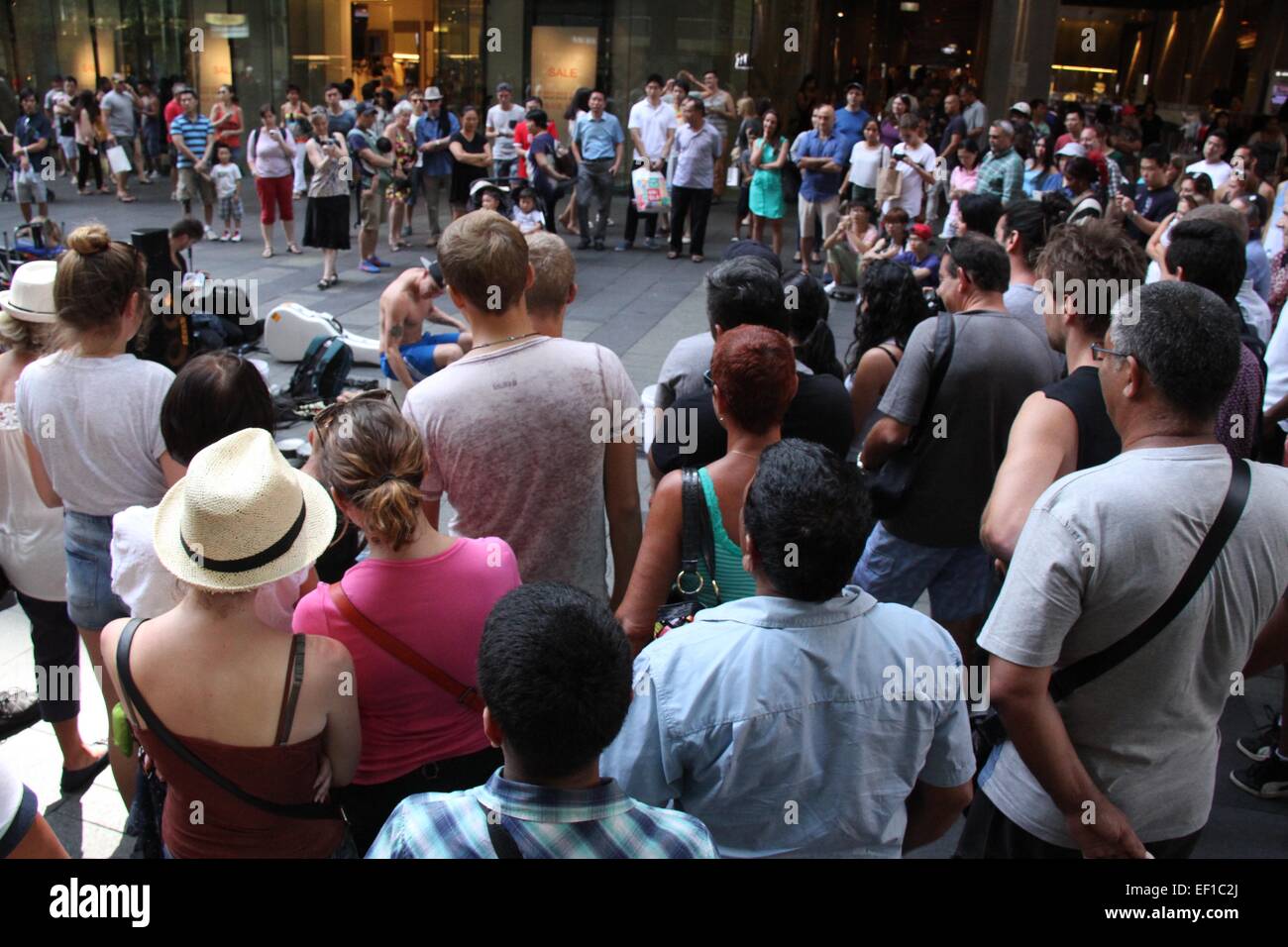 People watching street musician in hi-res stock photography and images ...