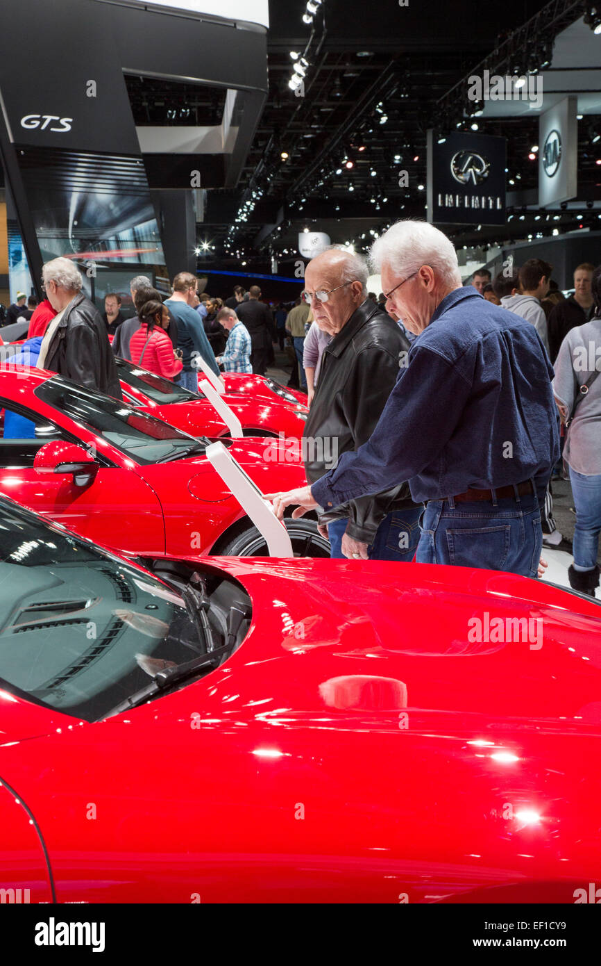 Detroit, Michigan - Visitors look over cars on display at the North ...
