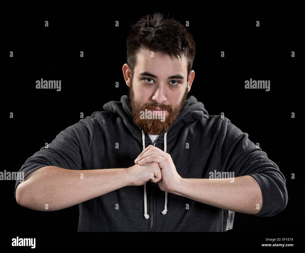 Serious Man with Closed Fist In Front his Body Stock Photo - Alamy