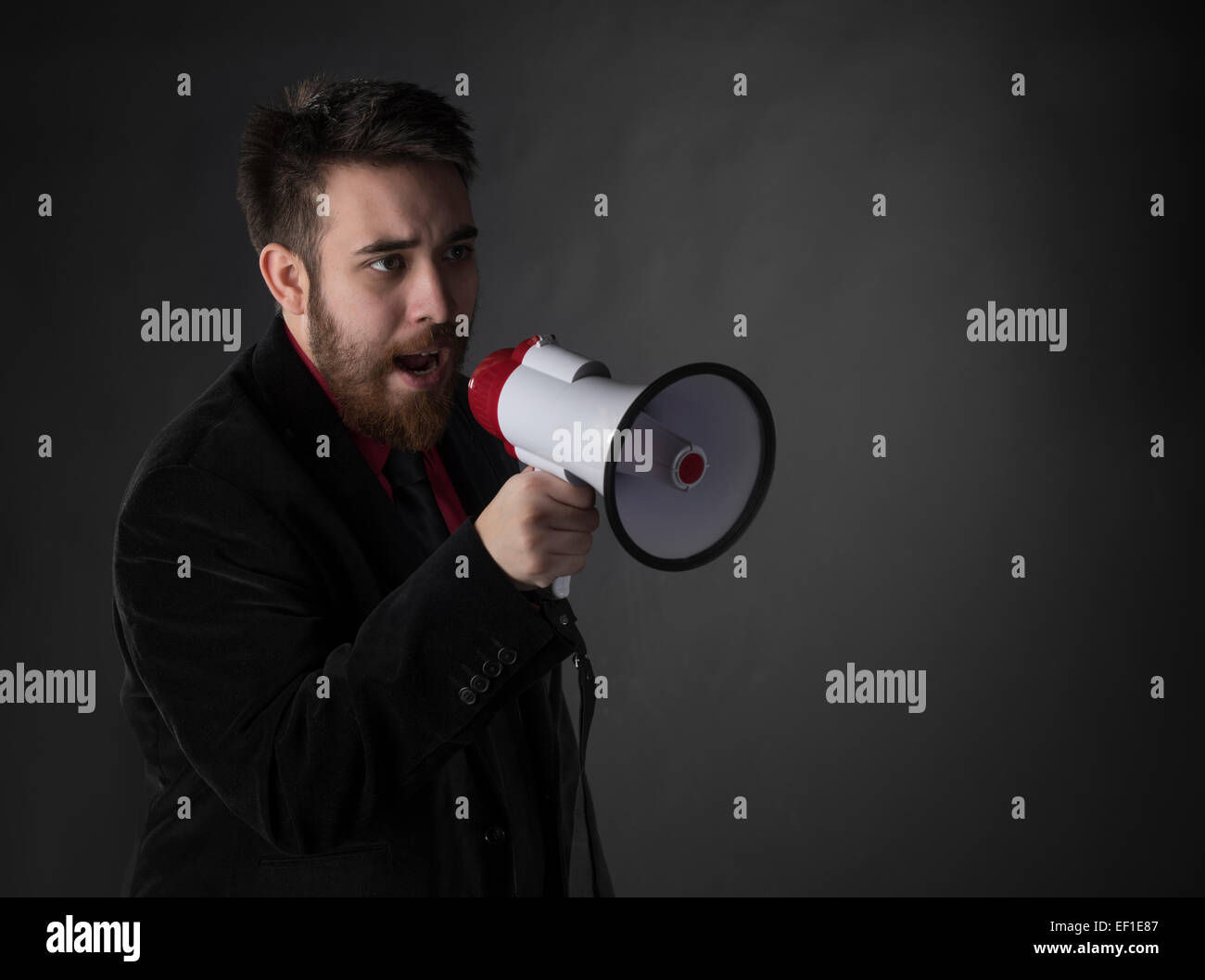 Talking Young Man Using Megaphone Stock Photo - Alamy