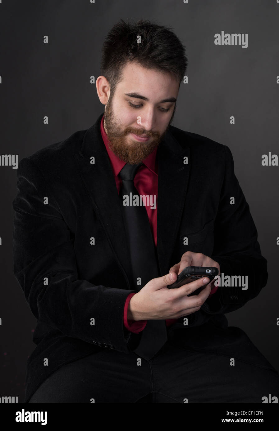 Smiling Man in Formal Attire with Phone Stock Photo - Alamy Smiling Man in Formal Attire with Phone Stock Photo - Alamy