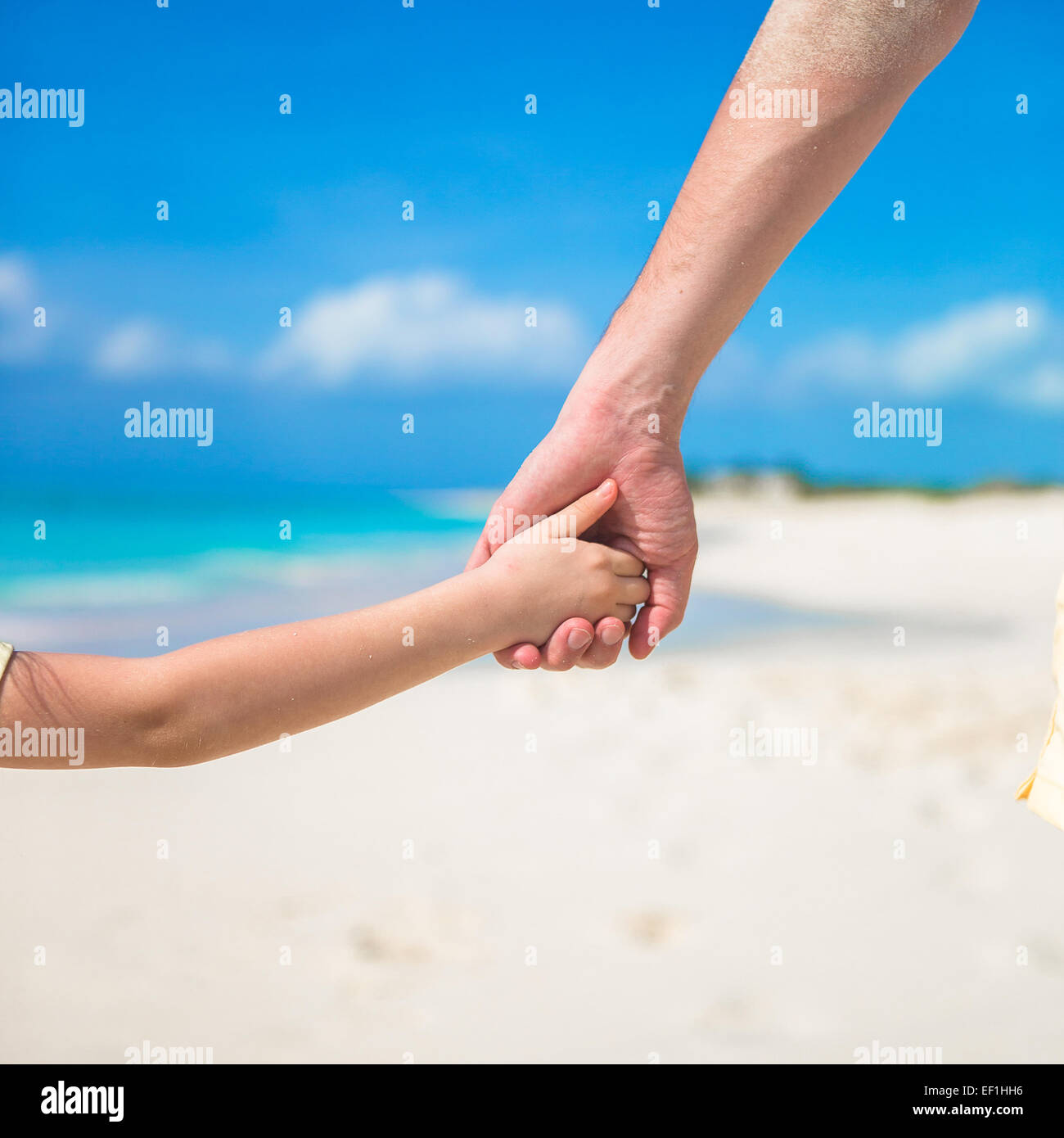 Close-up of male and kid's hands Stock Photo - Alamy
