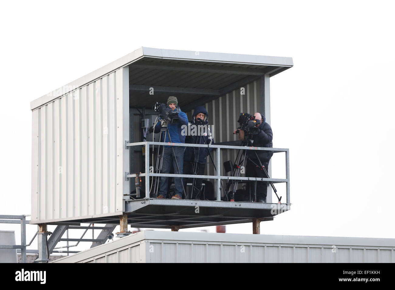 Television Cameramen filming a football match from a gantry on top of a ...