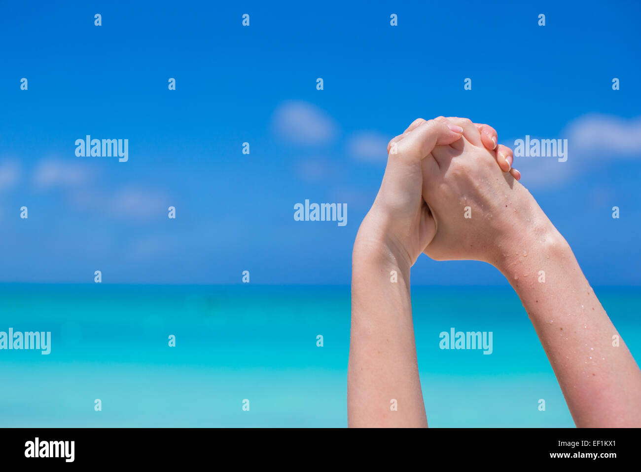 Closeup of hands making handshake background turquoise water Stock ...