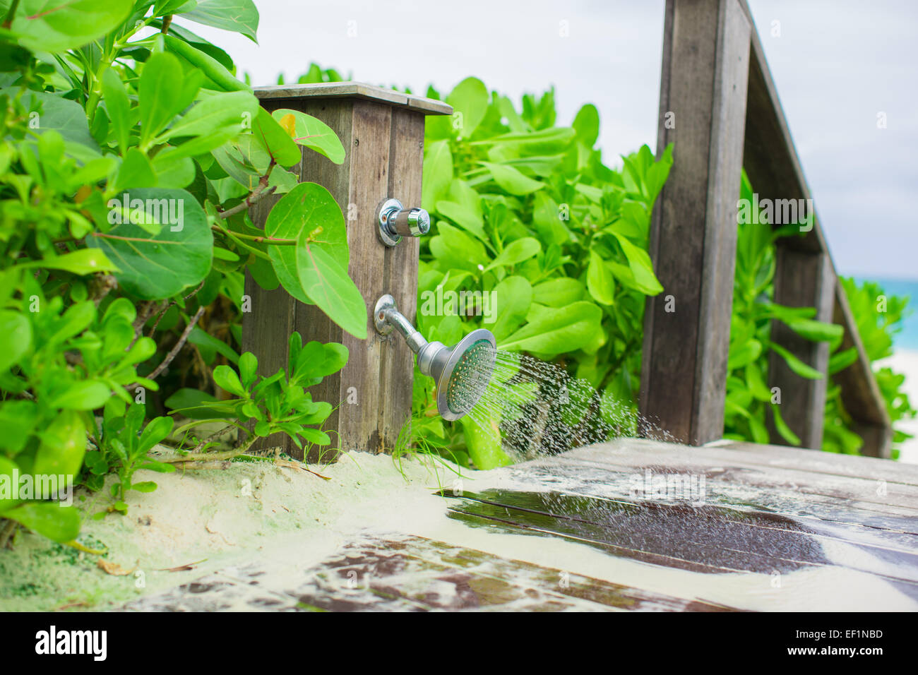 Closeup outdoor beach shower with water Stock Photo - Alamy