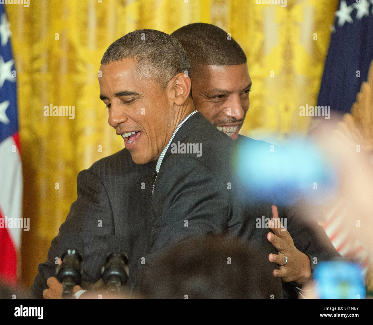 United States President Barack Obama hugs Mayor Kevin Johnson of ...