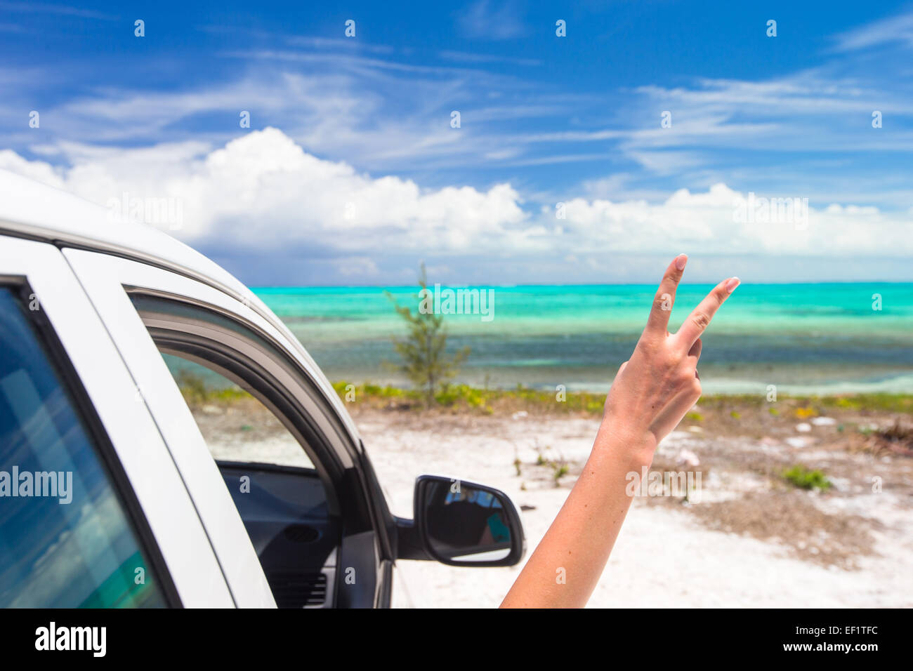 Close up raised hands at perfect beach Stock Photo - Alamy