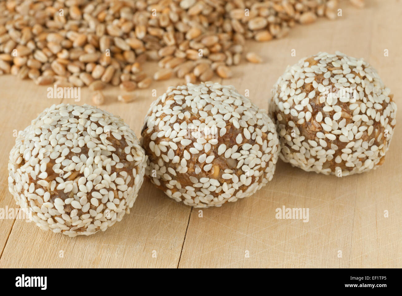 sweet balls from ground wheat sprouts with sesame seeds, cereal grains ...