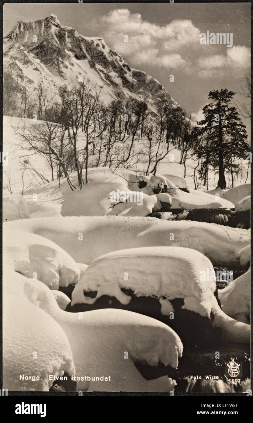 A winter scene captured by Anders Beer Wilse, showing a frozen river in ...