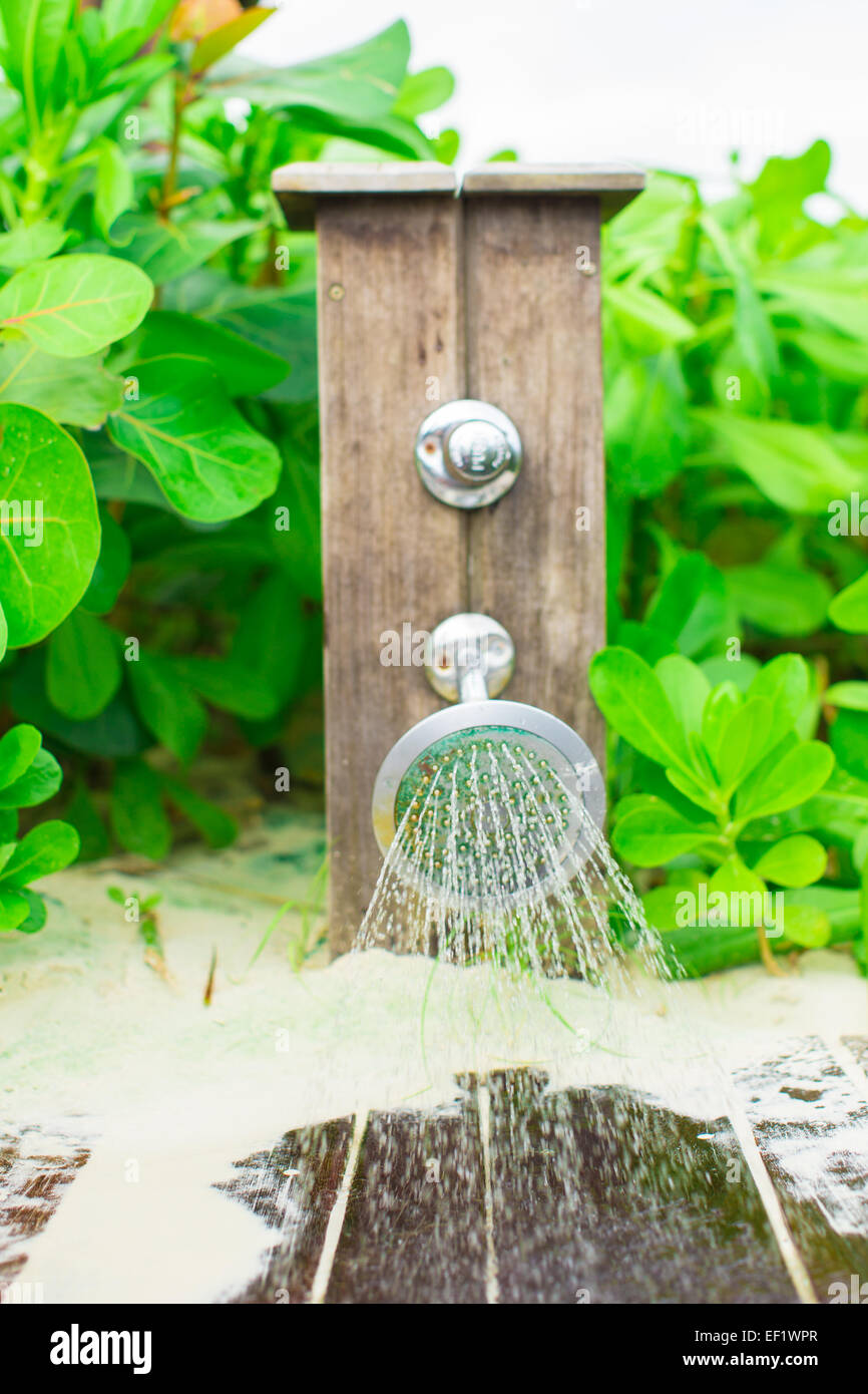 Close up outdoor beach shower with water Stock Photo - Alamy