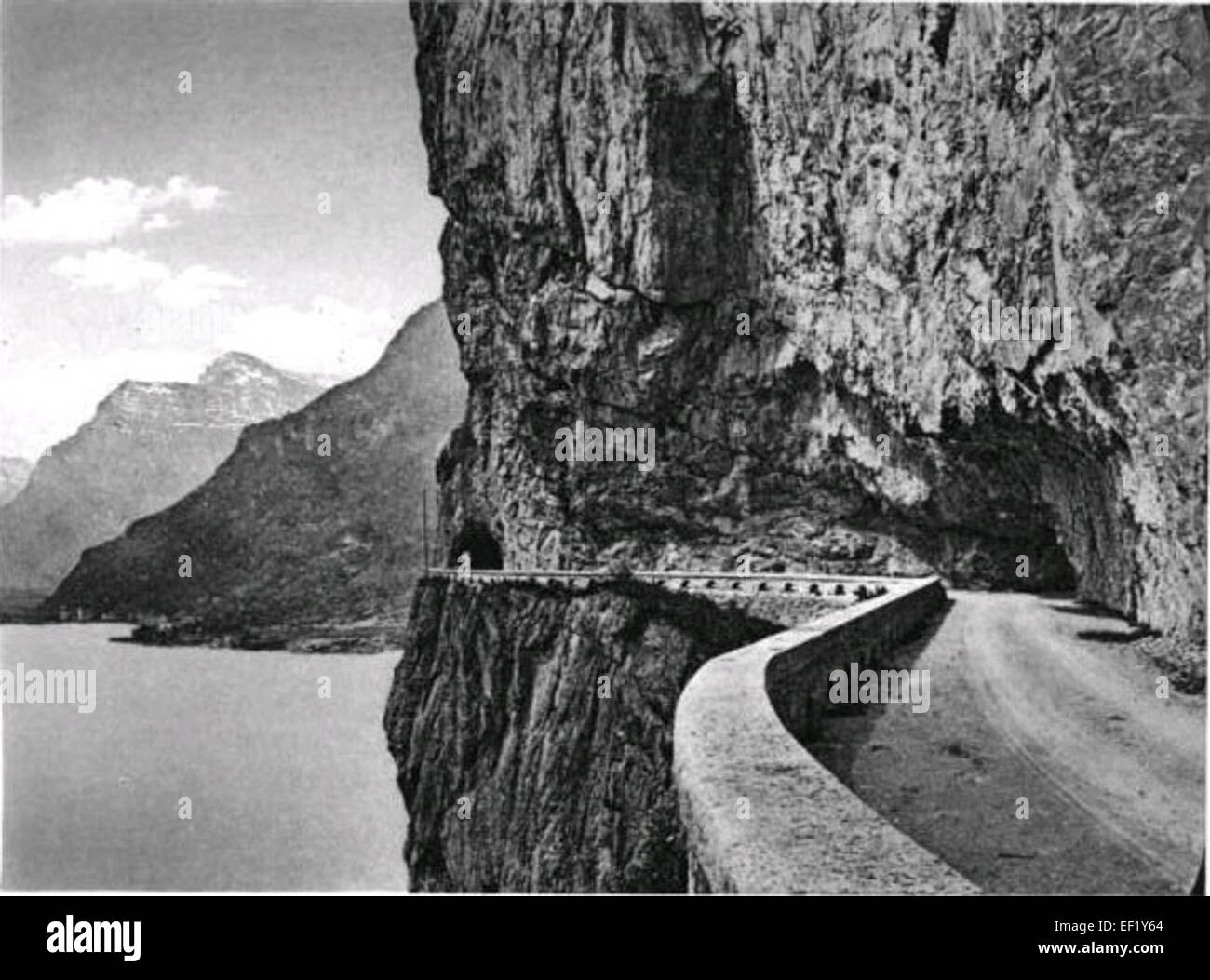 The image captures the Axenstrasse, a scenic road in Switzerland, with ...