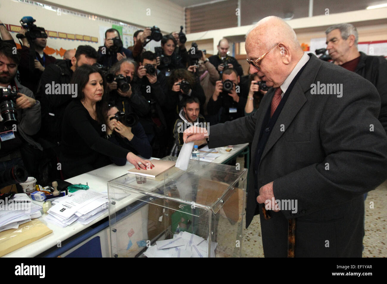 Athens, Greece. 25th Jan, 2015. A man casts his vote at a polling ...