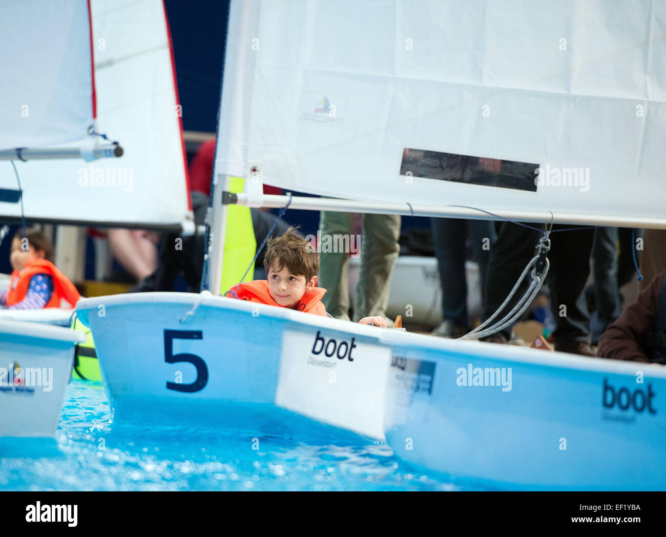 Seven-year old Simon Alexander steers an Optimist sailing dinghy at the ...
