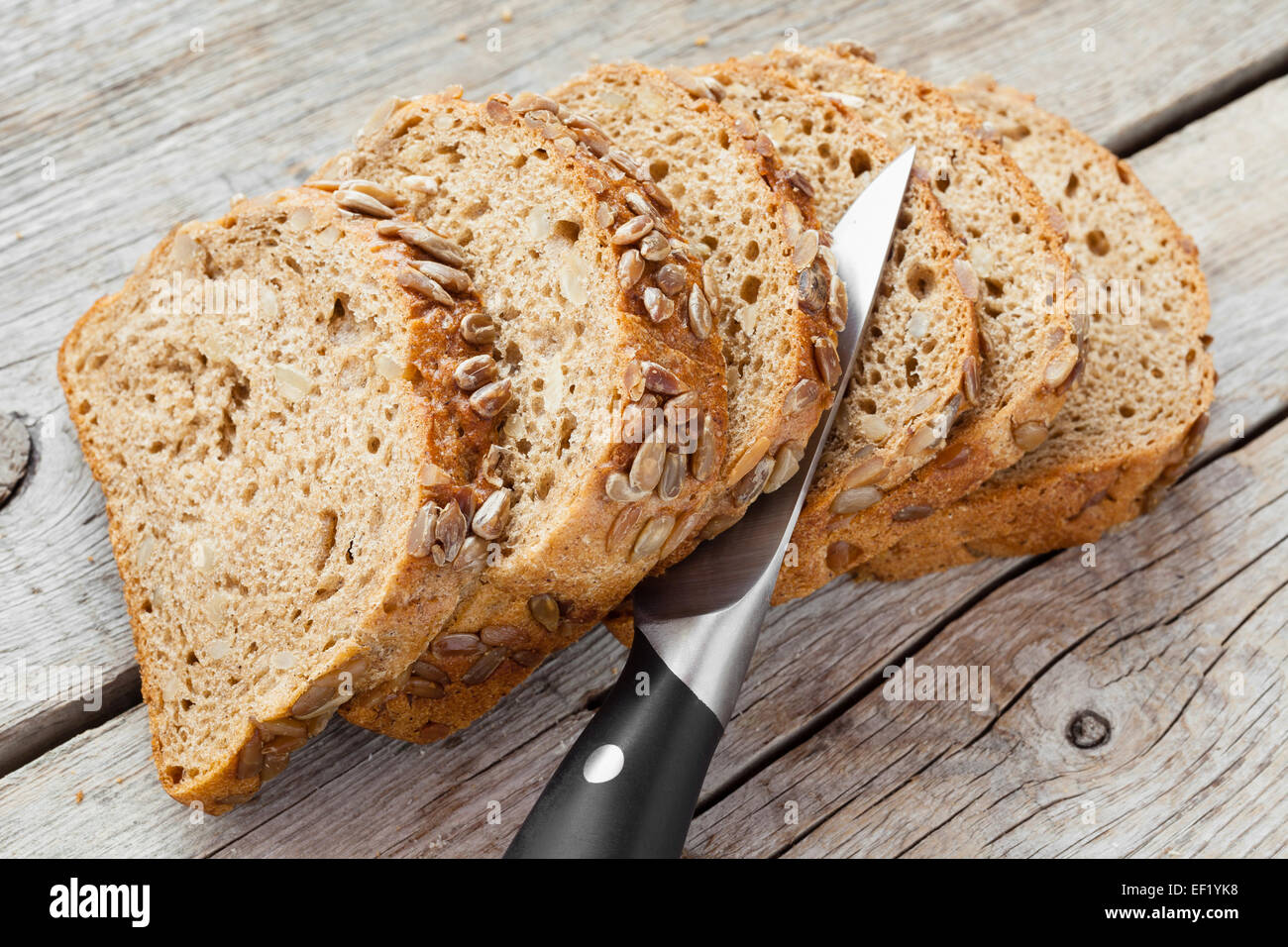 slices of rye bread and knife on kitchen table Stock Photo - Alamy