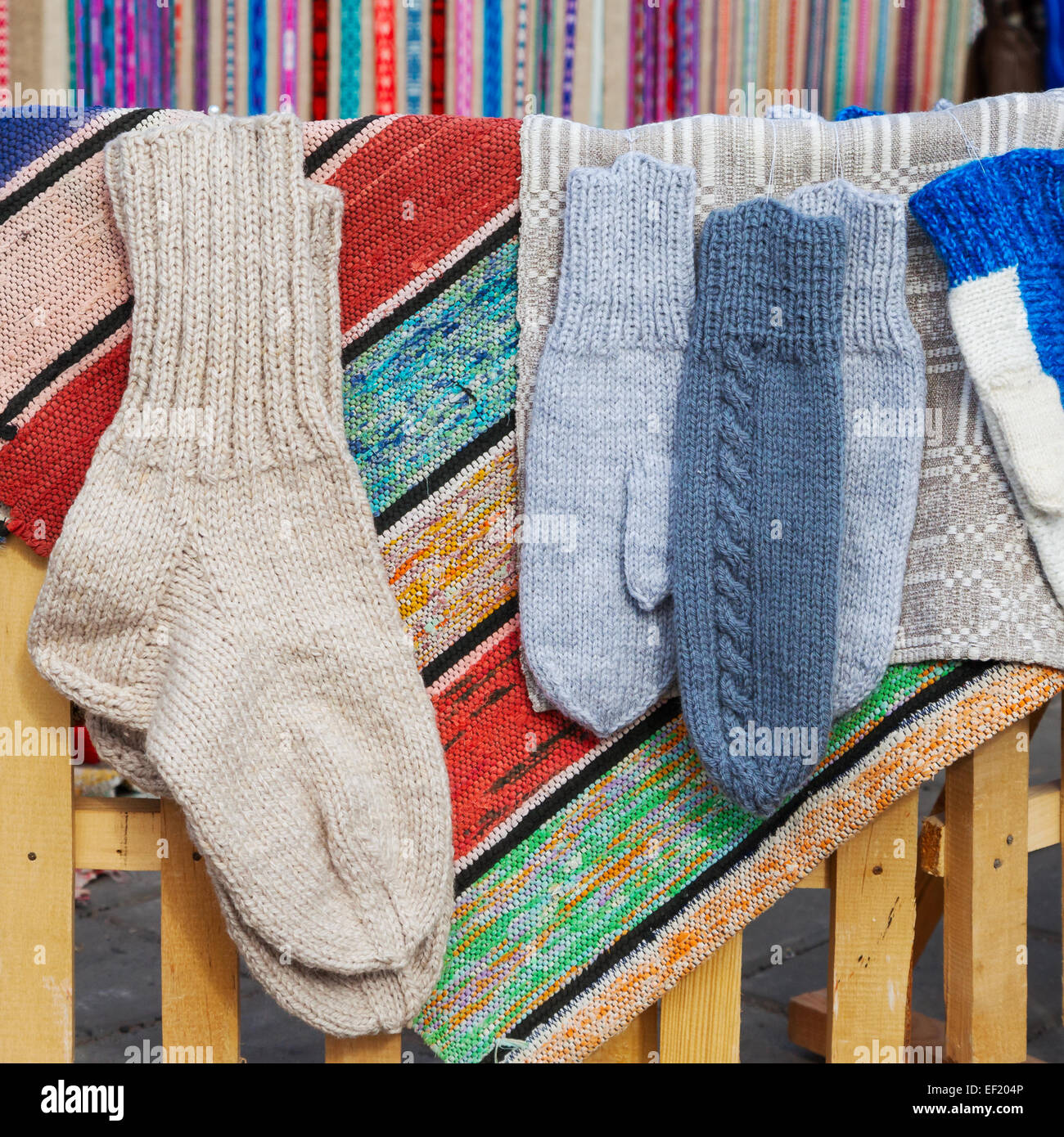 wool socks and mittens hanging on simple rustic cloth Stock Photo - Alamy