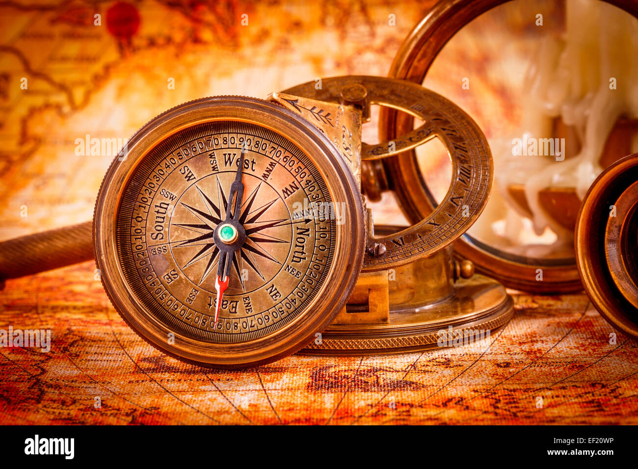 Vintage still life. Vintage magnifying glass lies on an ancient world ...