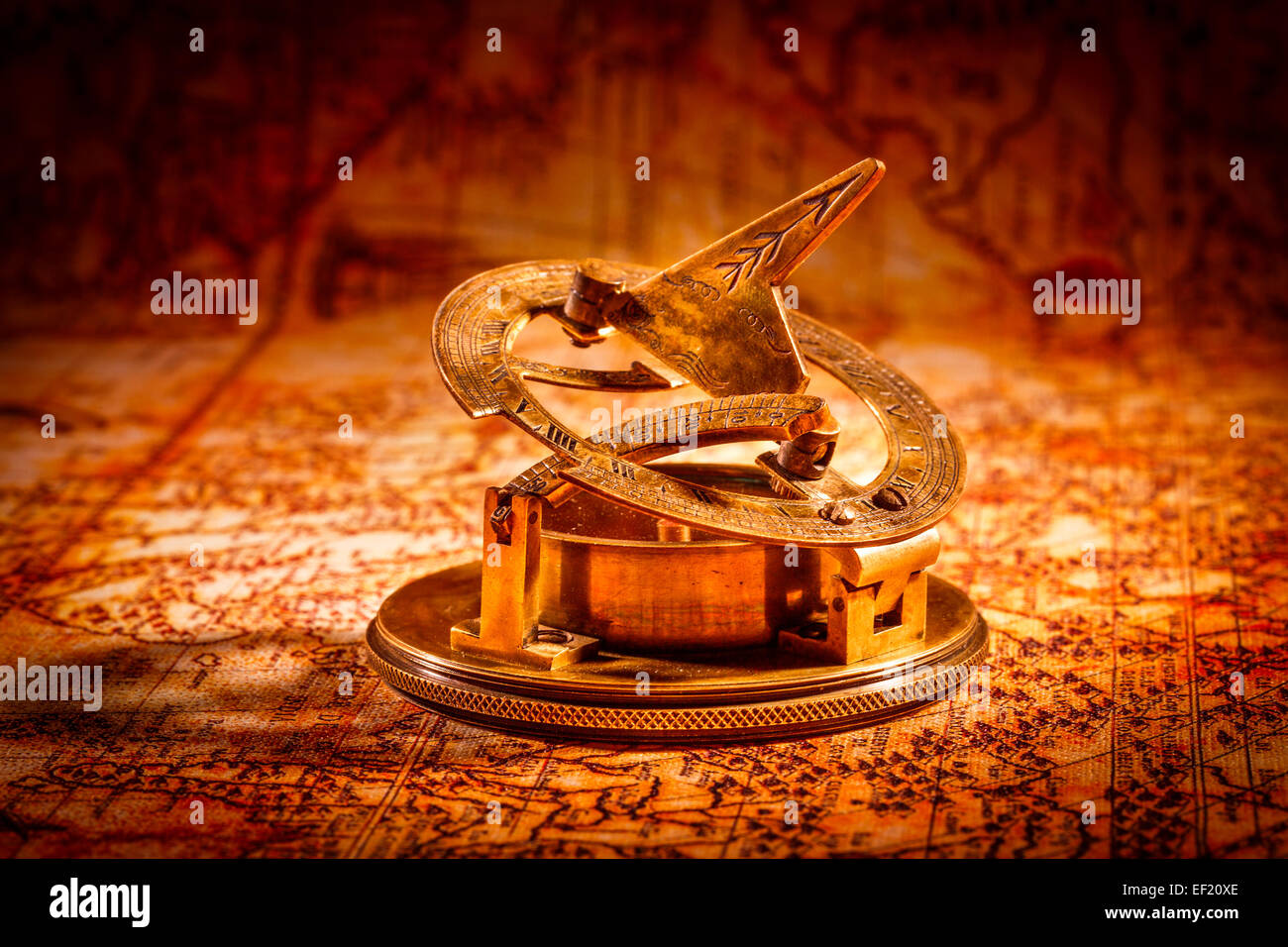 Vintage still life. Vintage compass lies on an ancient world map in ...