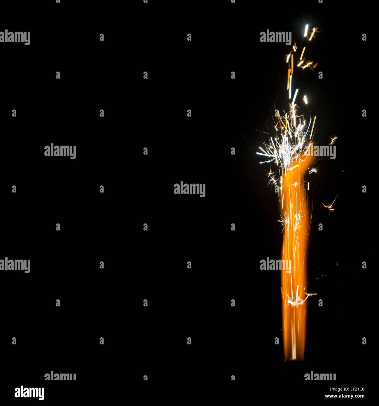 Burning Firework Sparkler Detail isolated on black with huge copy-space ...