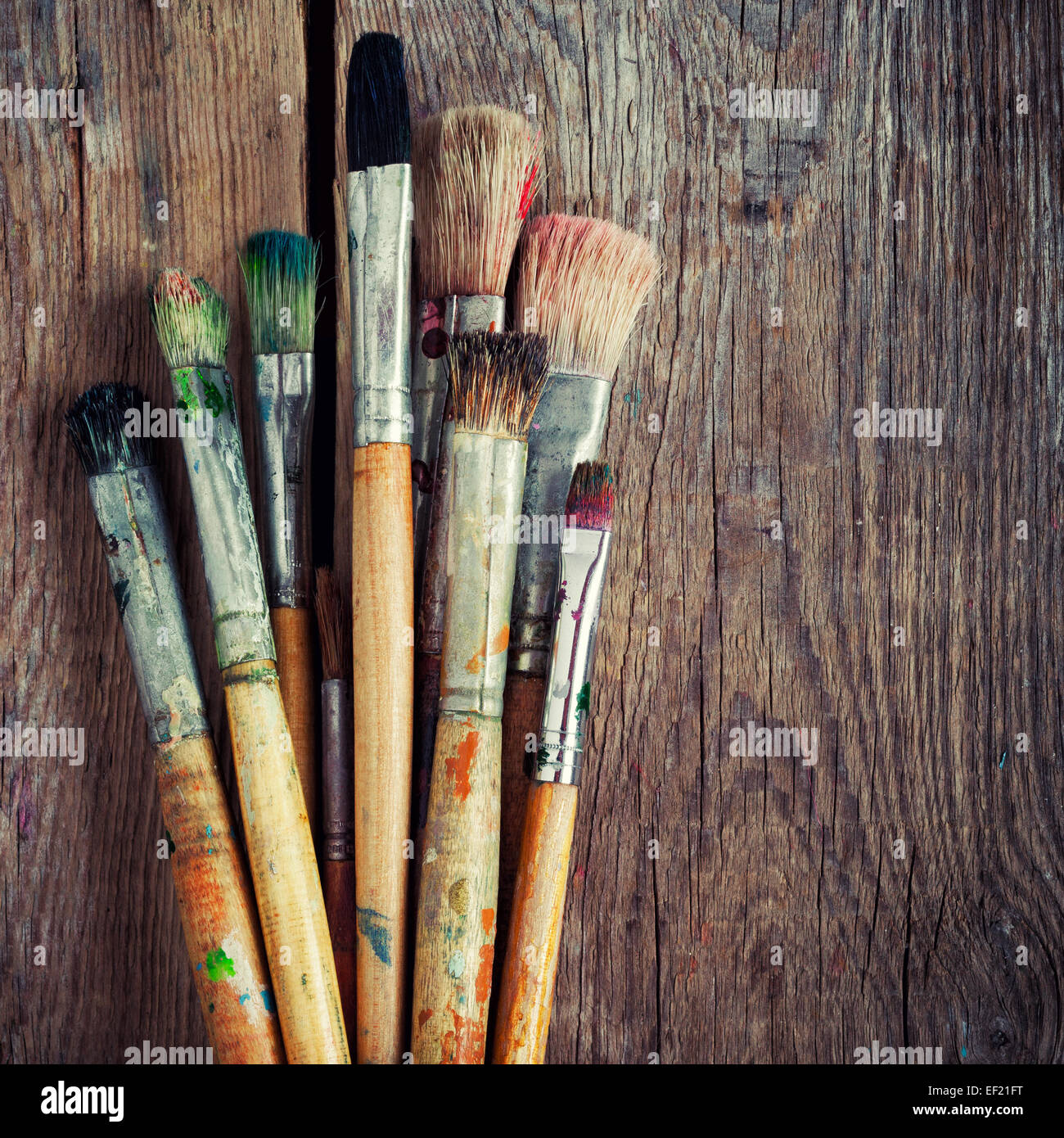 Bunch of old artist paintbrushes on wooden rustic table Stock Photo - Alamy