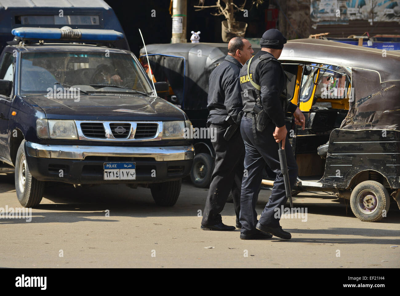 Cairo, Egypt. 25th Jan, 2015. Egyptian security forces stand guard at ...