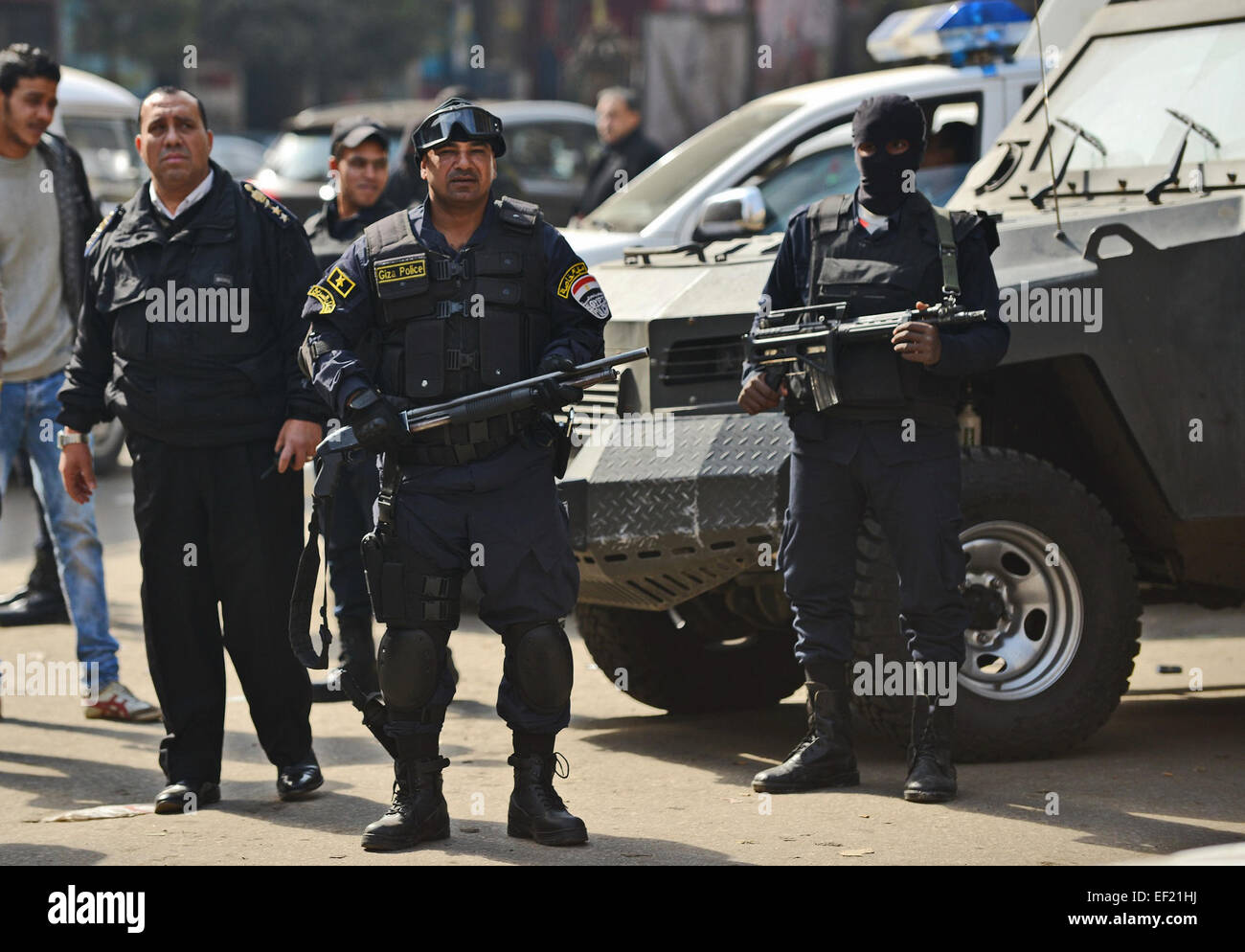 Cairo, Egypt. 25th Jan, 2015. Egyptian security forces stand guard at ...