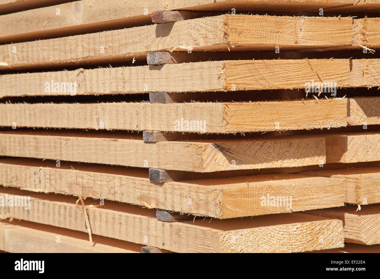 Stack of new wooden studs at the lumber yard Stock Photo - Alamy