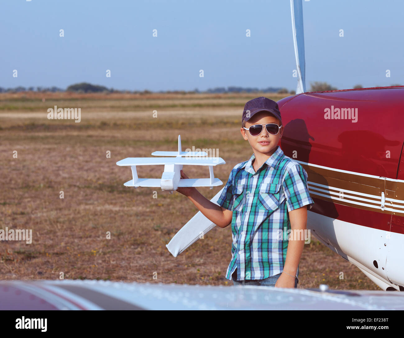 Little boy pilot with handmade plane at the airport Stock Photo - Alamy