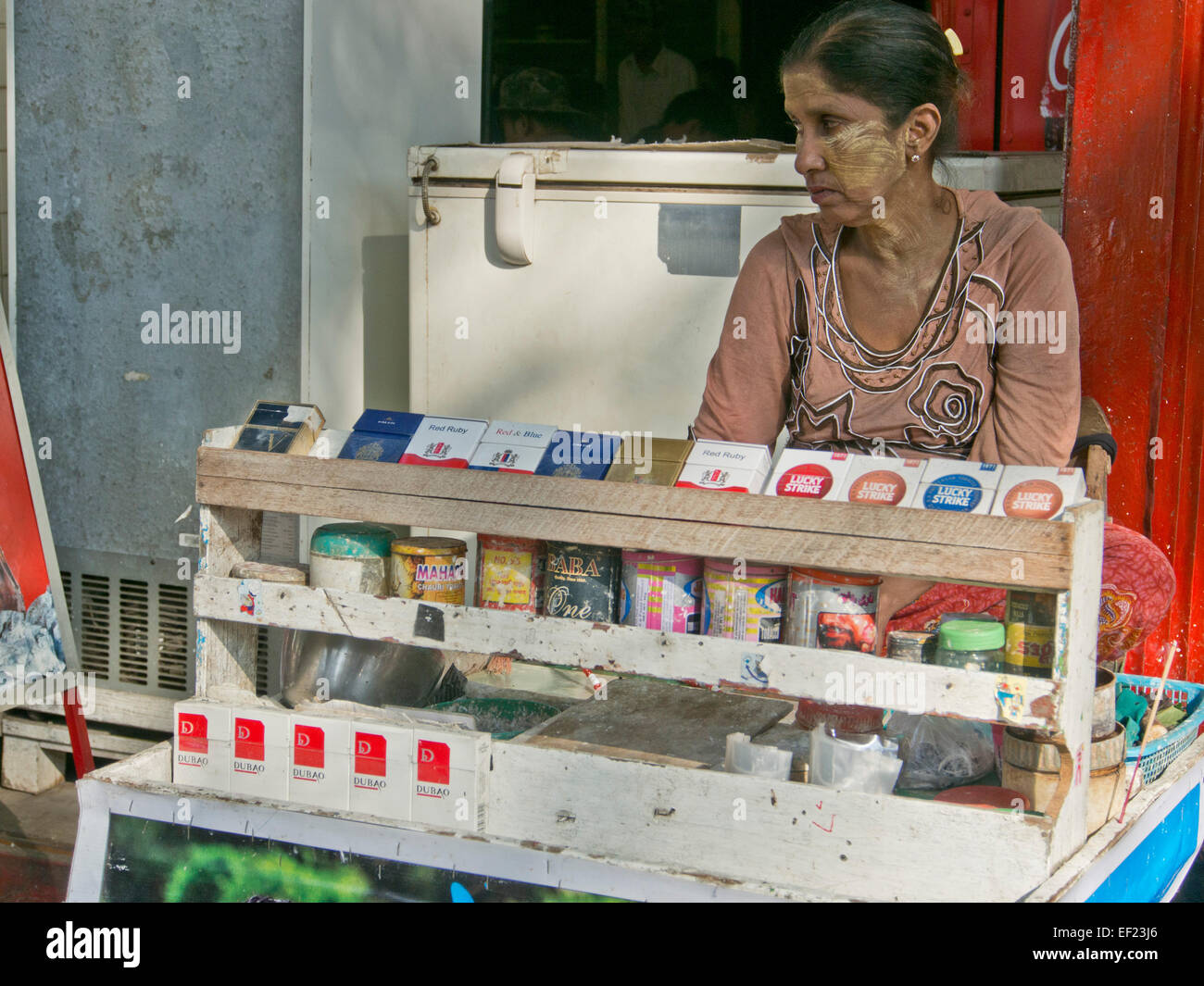 Women selling cigarettes at market place in Yangon, Myanmar Stock Photo ...
