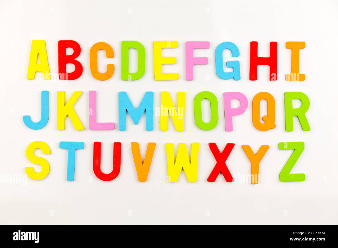 Colorful alphabet magnets on a whiteboard Stock Photo - Alamy