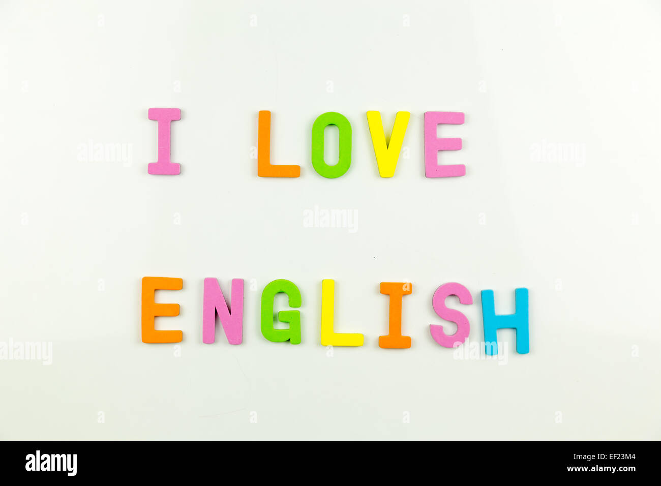 Colorful alphabet magnets on a whiteboard with phrase, I Love English ...