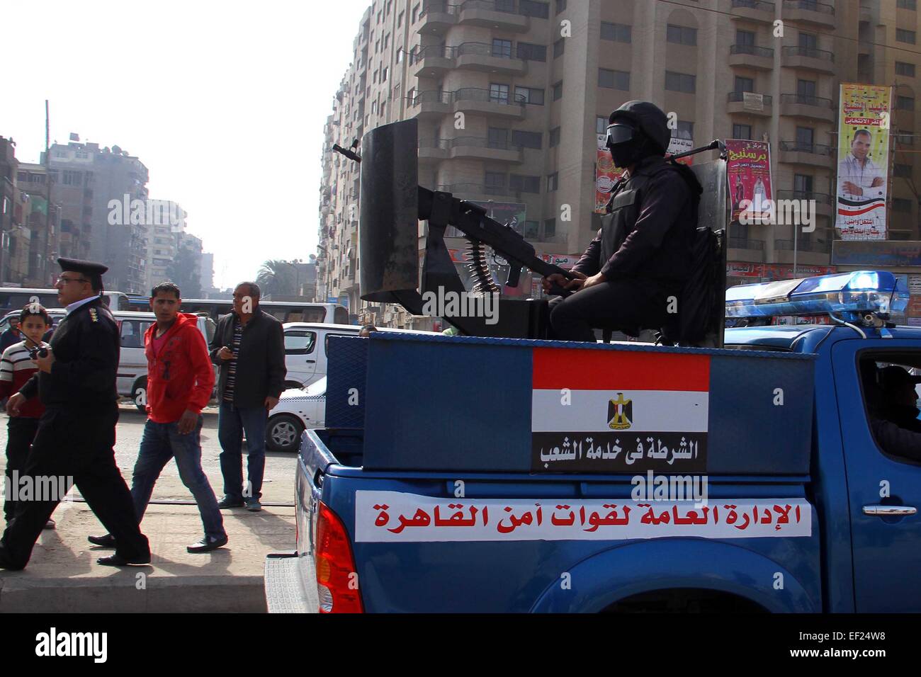 Cairo. 25th Jan, 2015. A riot police stands guard in the district of Al ...