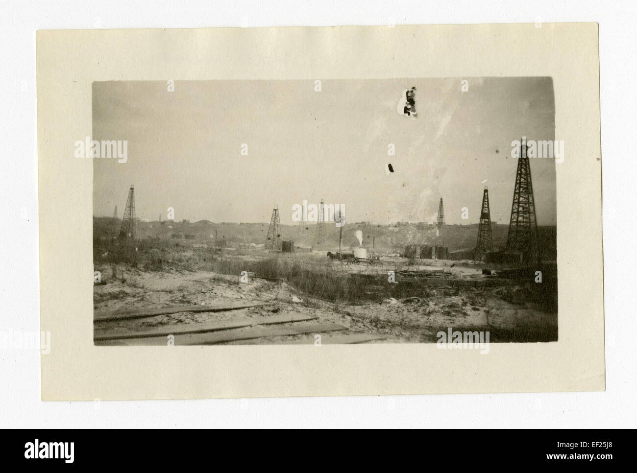 The derricks in the Red River oil fields, located in Texas, represent a ...