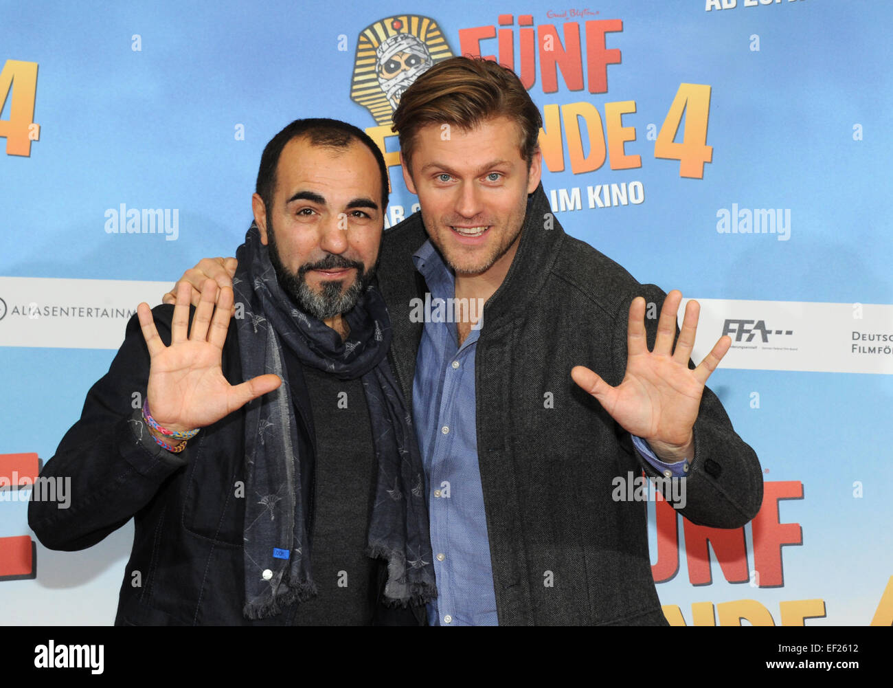 Actors Jens Atzhorn (L) and Adnan Maral pose in front of the movie ...