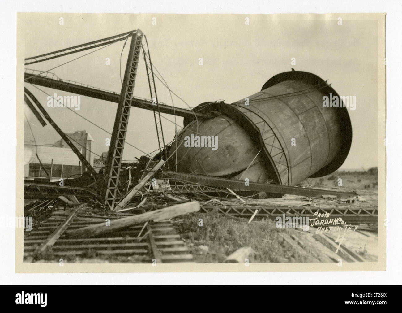 This water tank was torn from its heavy steel frame and partly ...