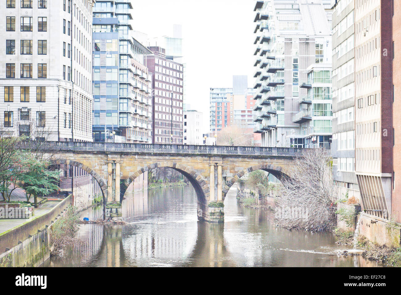 Bridge over a canal in Manchester with modern buildings Stock Photo - Alamy