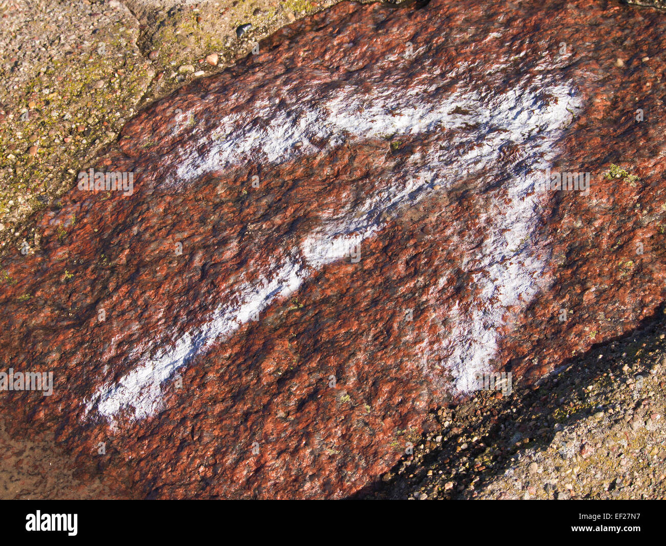 Painted arrow on a stone Stock Photo - Alamy