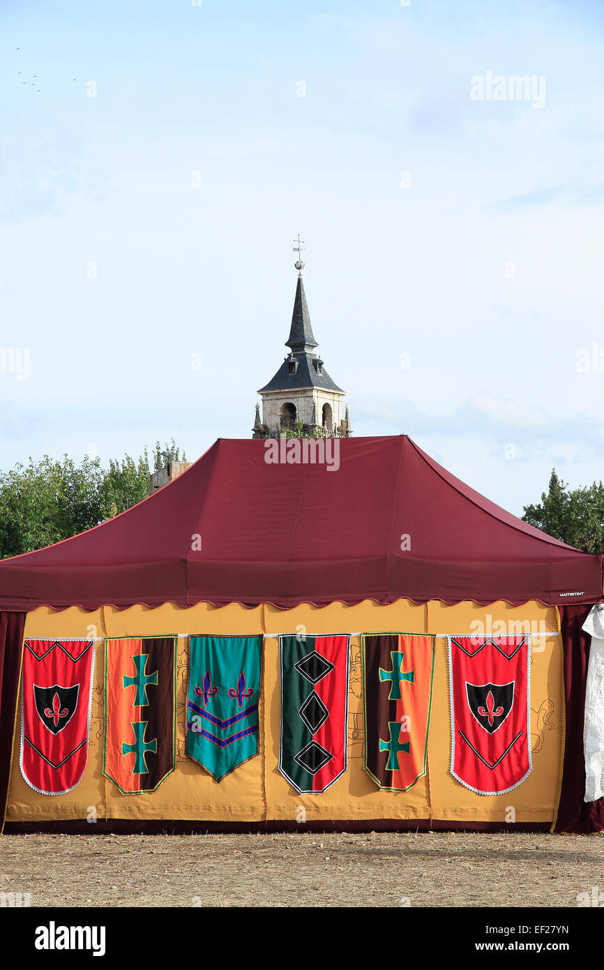medieval military tent with a belltower at the background on a ...