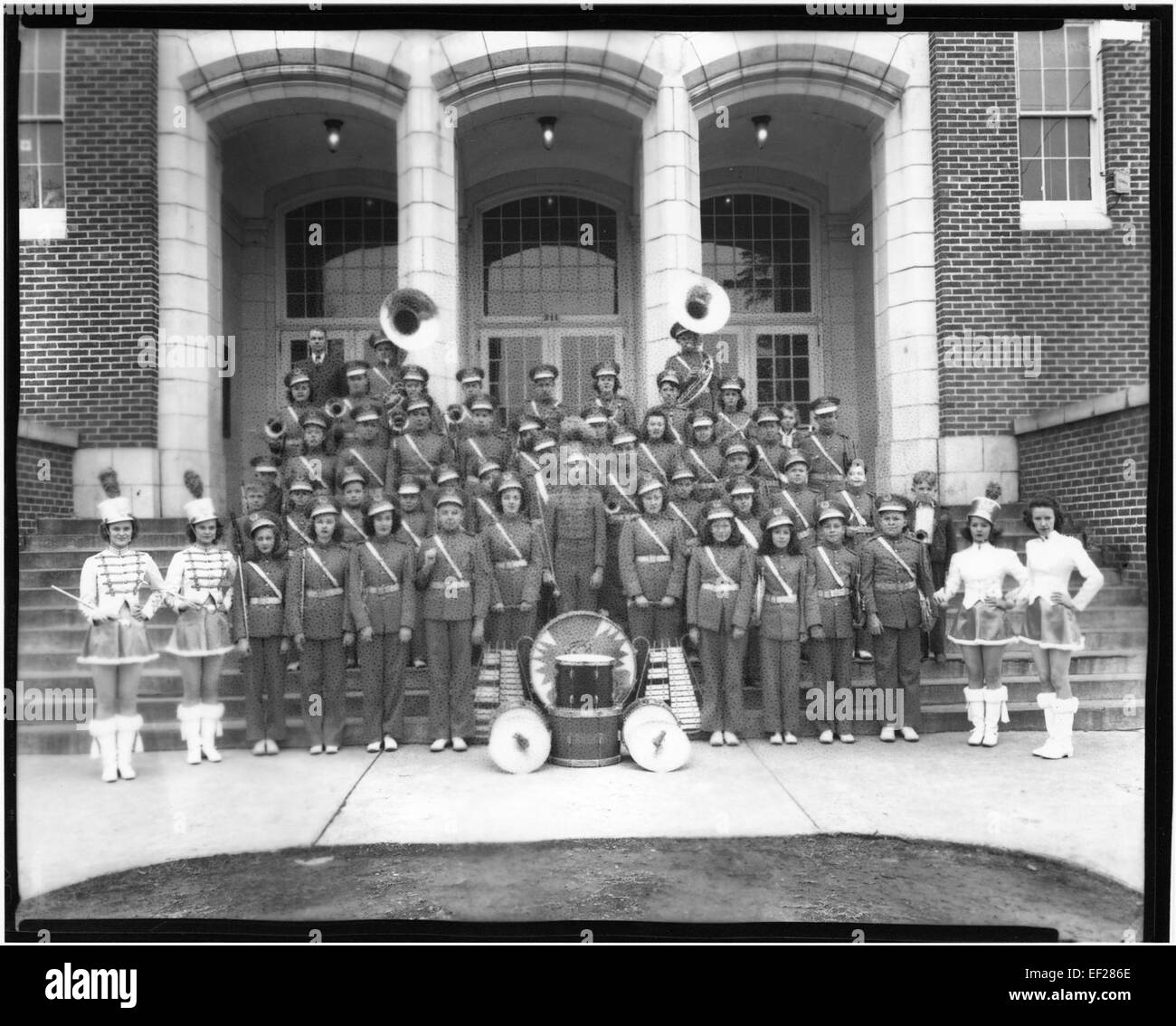 Director Harry Rayburn leads a musical band in 1942, a moment captured ...