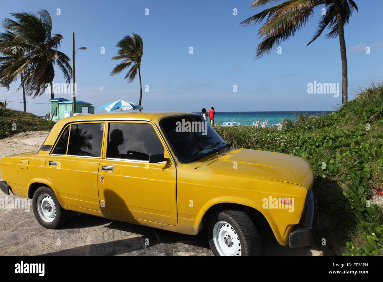 Yellow Lada parked by the beach in Santa Maria del Mar, part of the ...