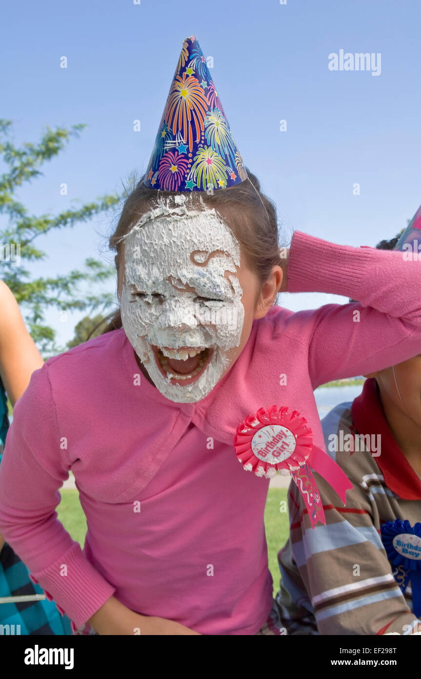 Child's face covered in icing Stock Photo - Alamy