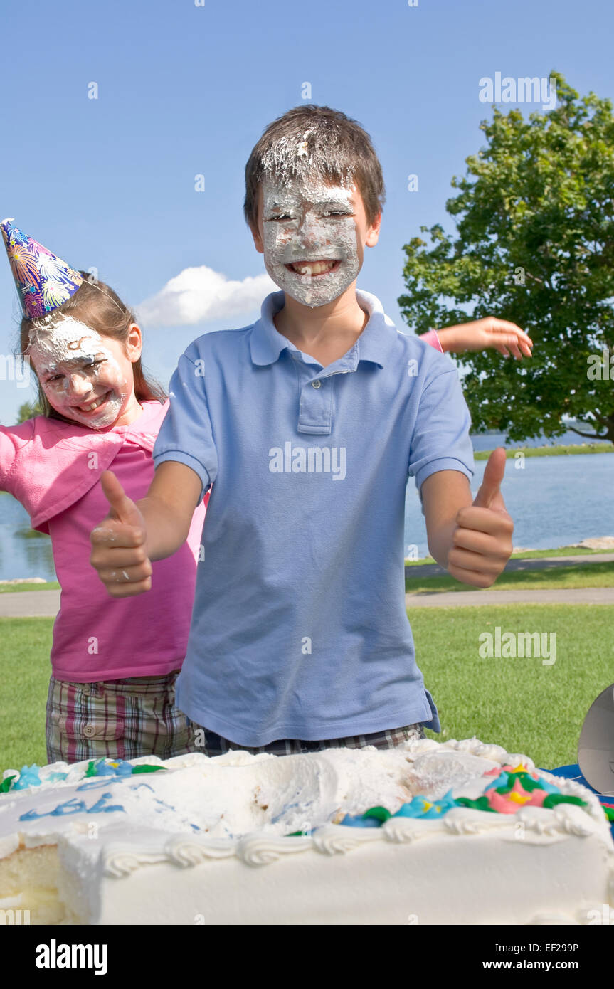 Children eating birthday cake hands hi-res stock photography and images ...