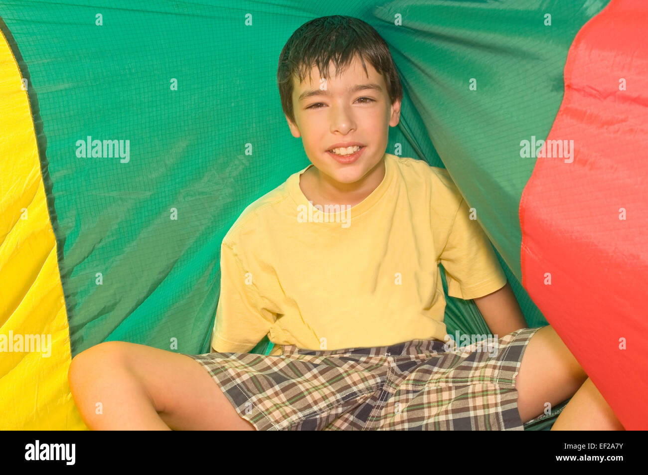 Boy under a parachute Stock Photo - Alamy