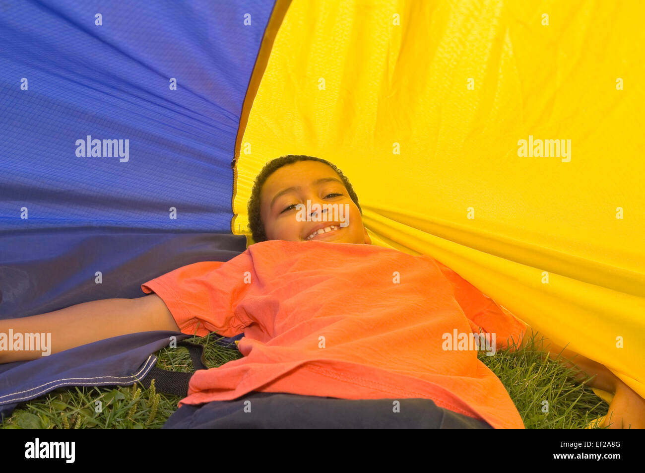 Boy under a parachute Stock Photo - Alamy