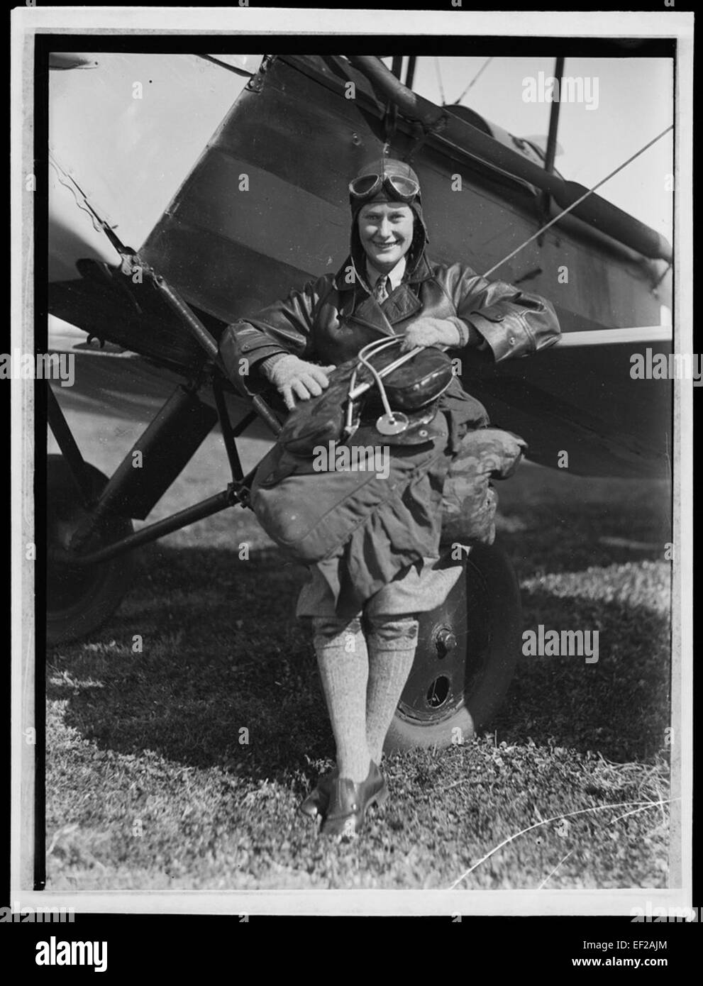 Nancy Bird, an Australian aviator, is shown standing in front of her ...