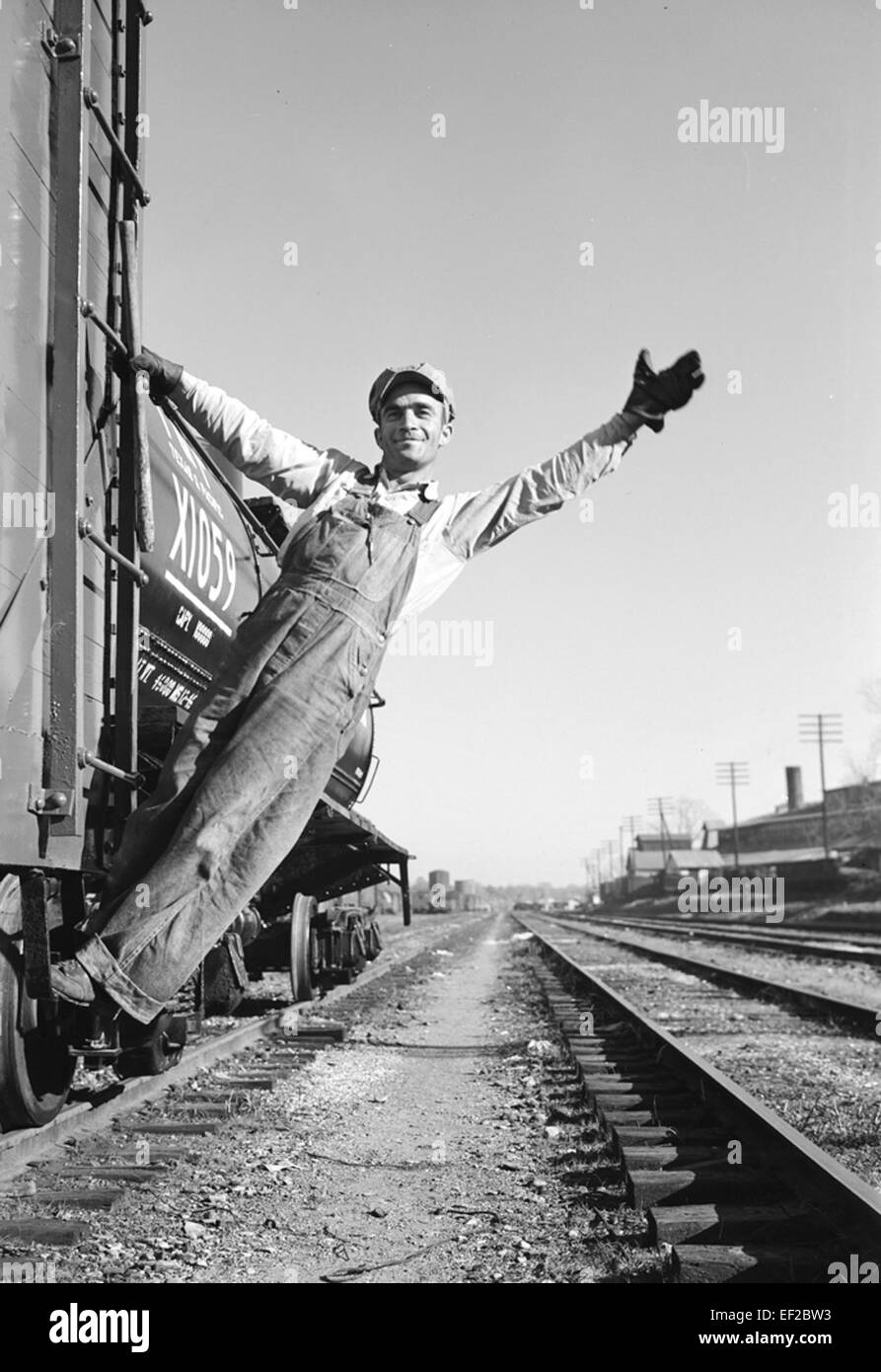 The image features a brakeman signaling Water Car X1059, part of the ...