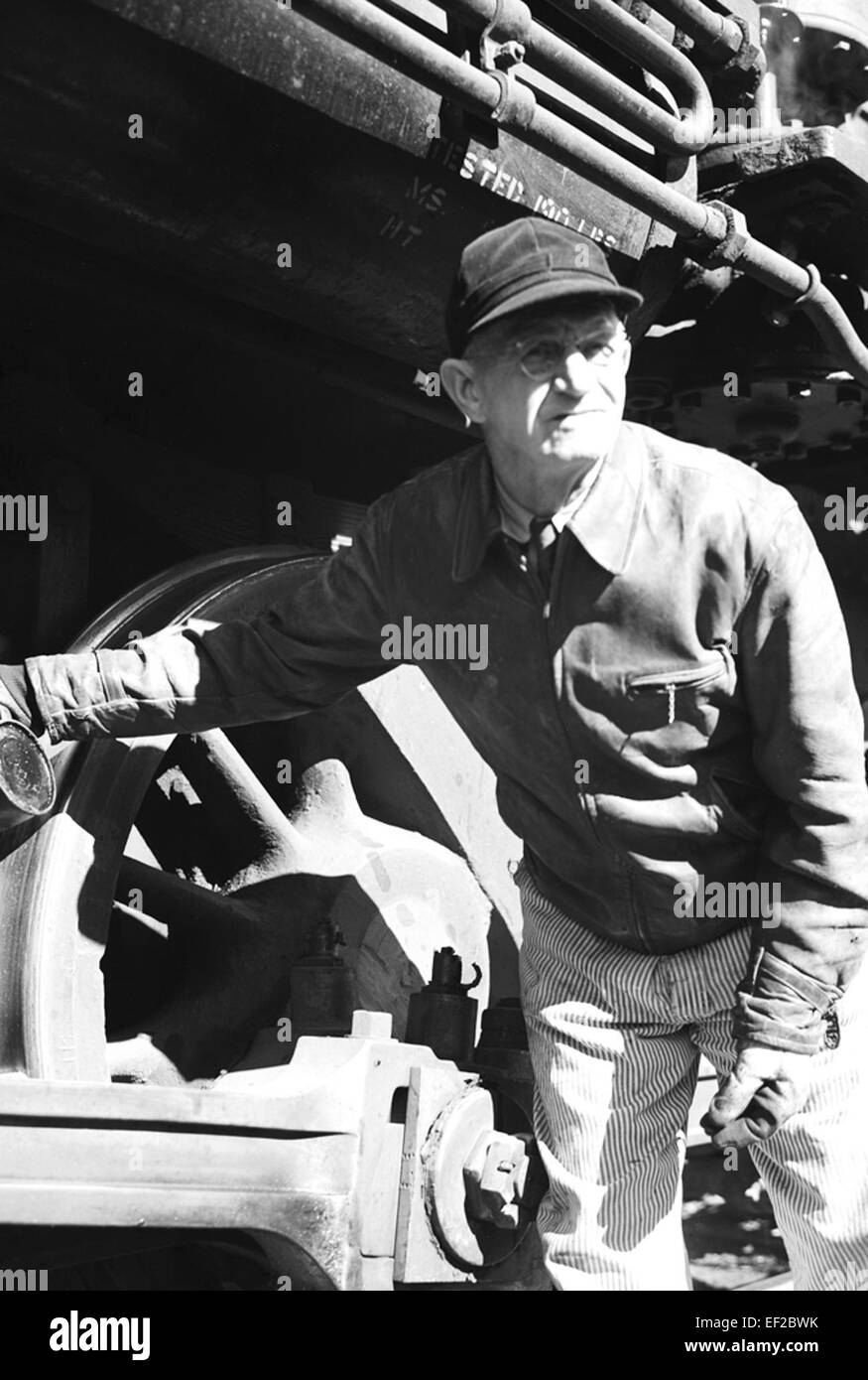 An engineer with an oil can, part of the Texas & Pacific Railway ...