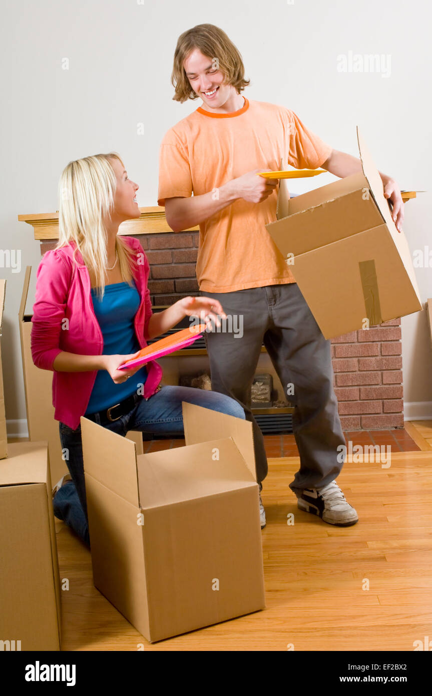 Two people packing boxes Stock Photo - Alamy