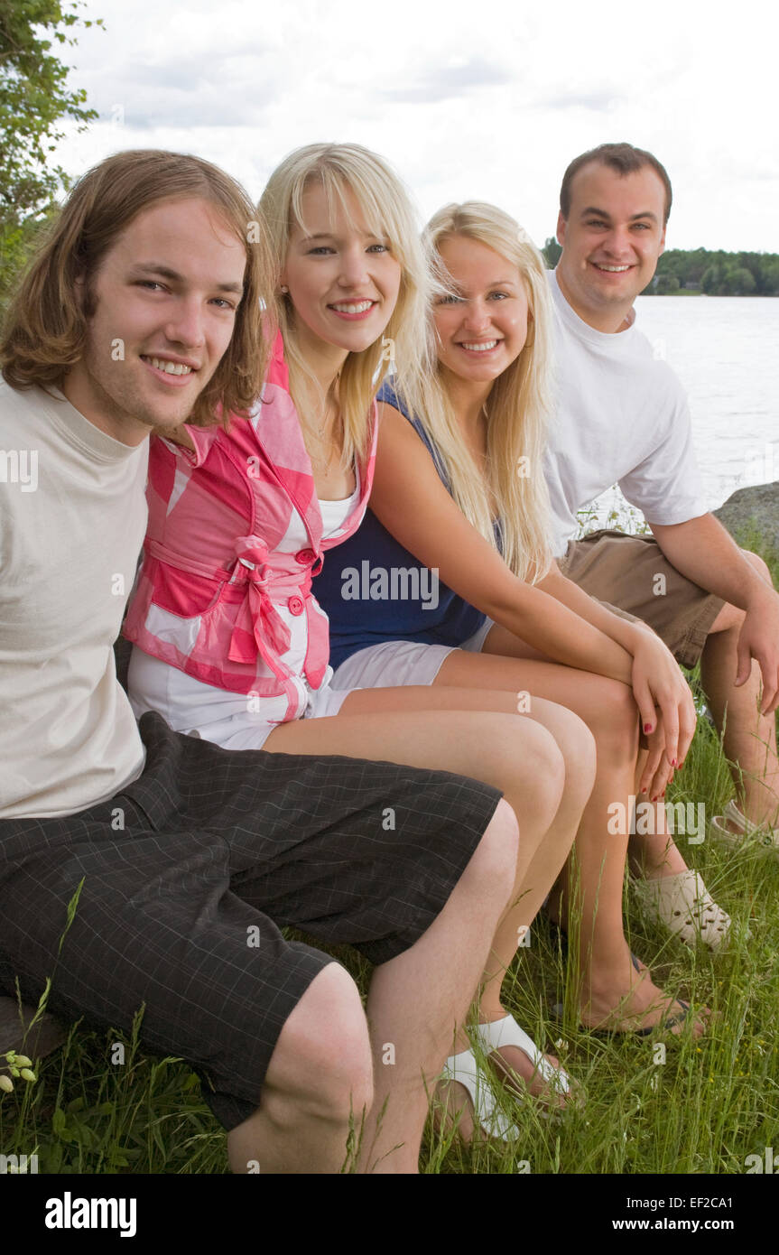 Four people sitting hi-res stock photography and images - Alamy