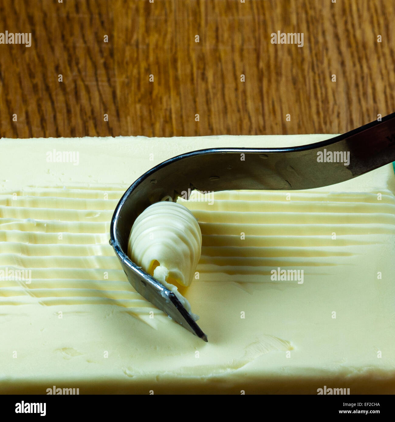 Making a roll of butter Stock Photo - Alamy